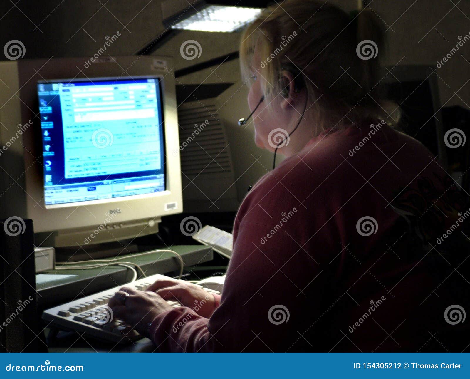 Police Dispatcher Using a Computer To Dispatch Units To Calls for Help ...