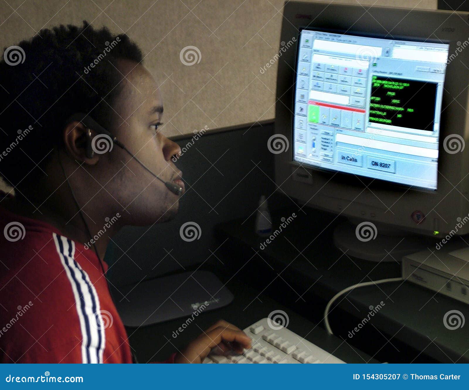 Police Dispatcher Using a Computer To Dispatch Units To Calls for Help ...