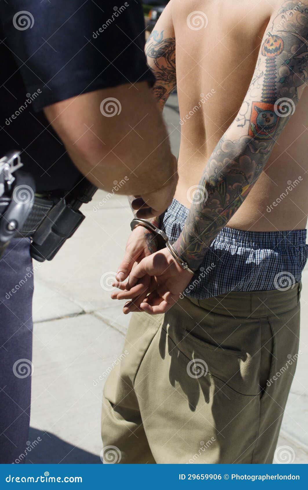 Police Officer Arresting Young Man Stock Photo - Image of adult ...