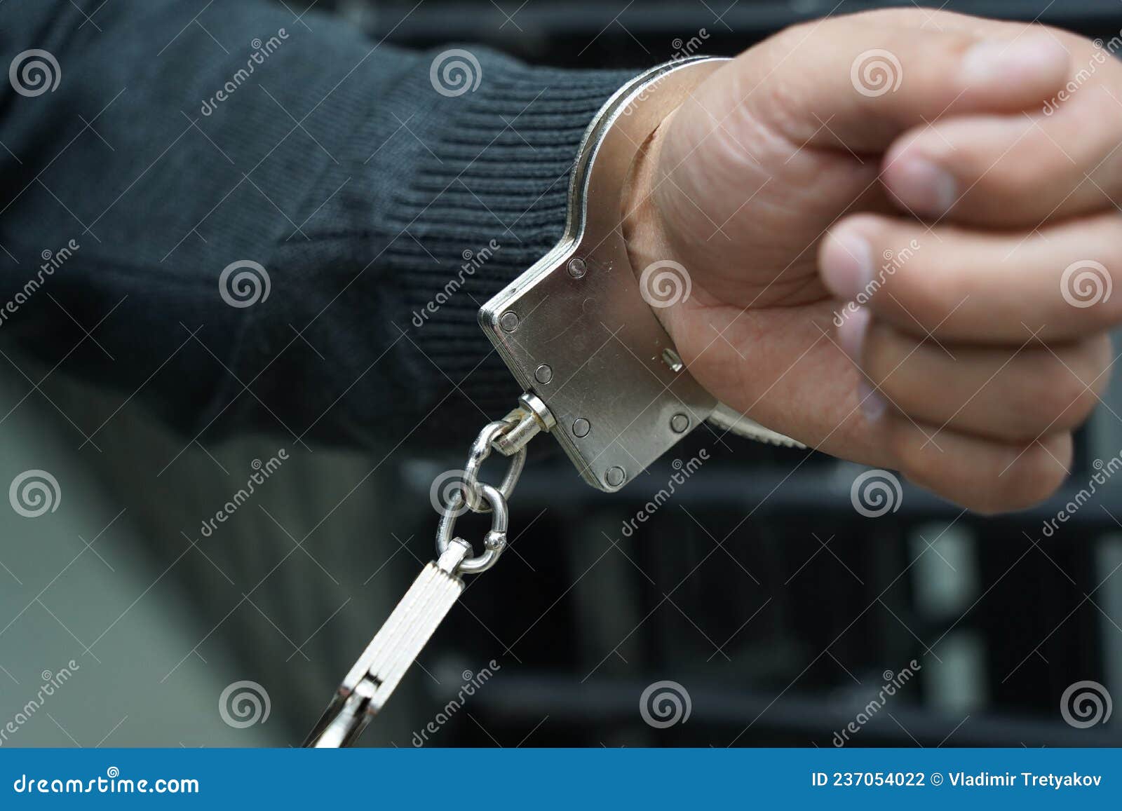 A Police Officer Handcuffs a Suspect Stock Photo - Image of hand ...