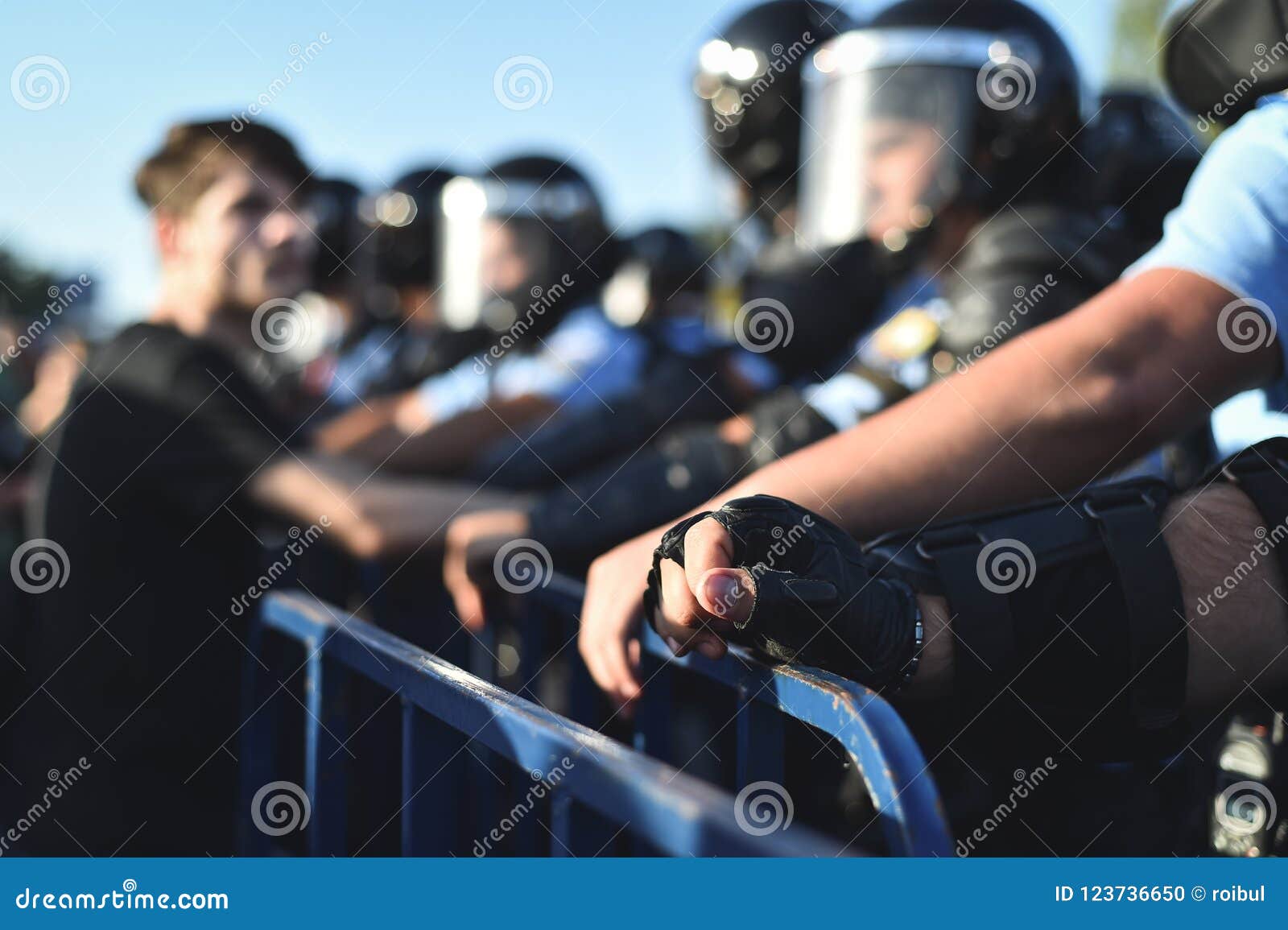 Security Staff Hands on a Protection Fence during a Riot Stock Photo ...