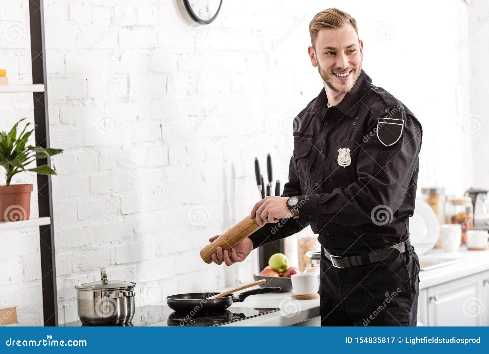 Police Officer Smiling and Cooking Breakfast Stock Image - Image of ...