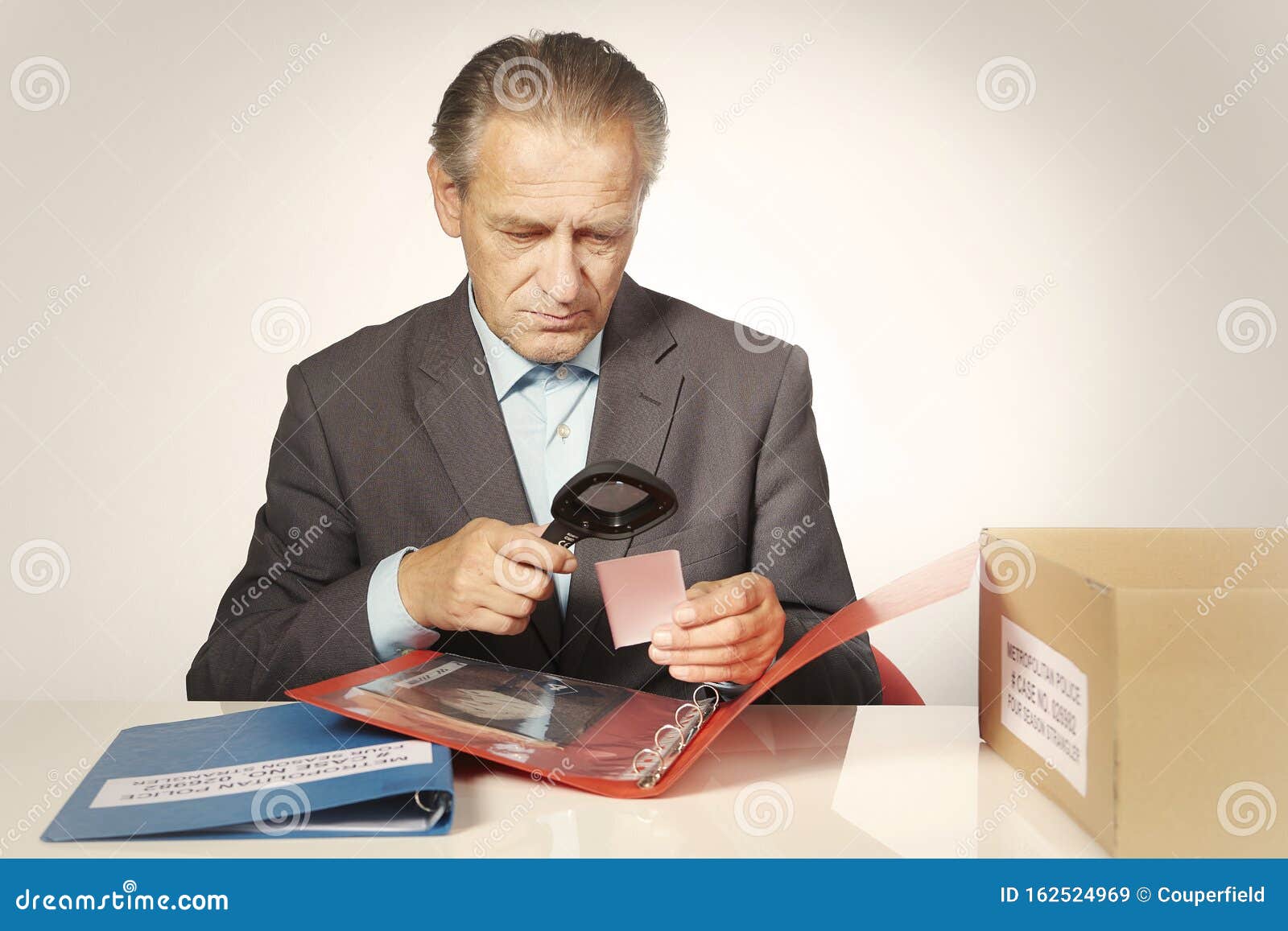 Detective Agent Studying Case and Documentation and Evidences Stock ...