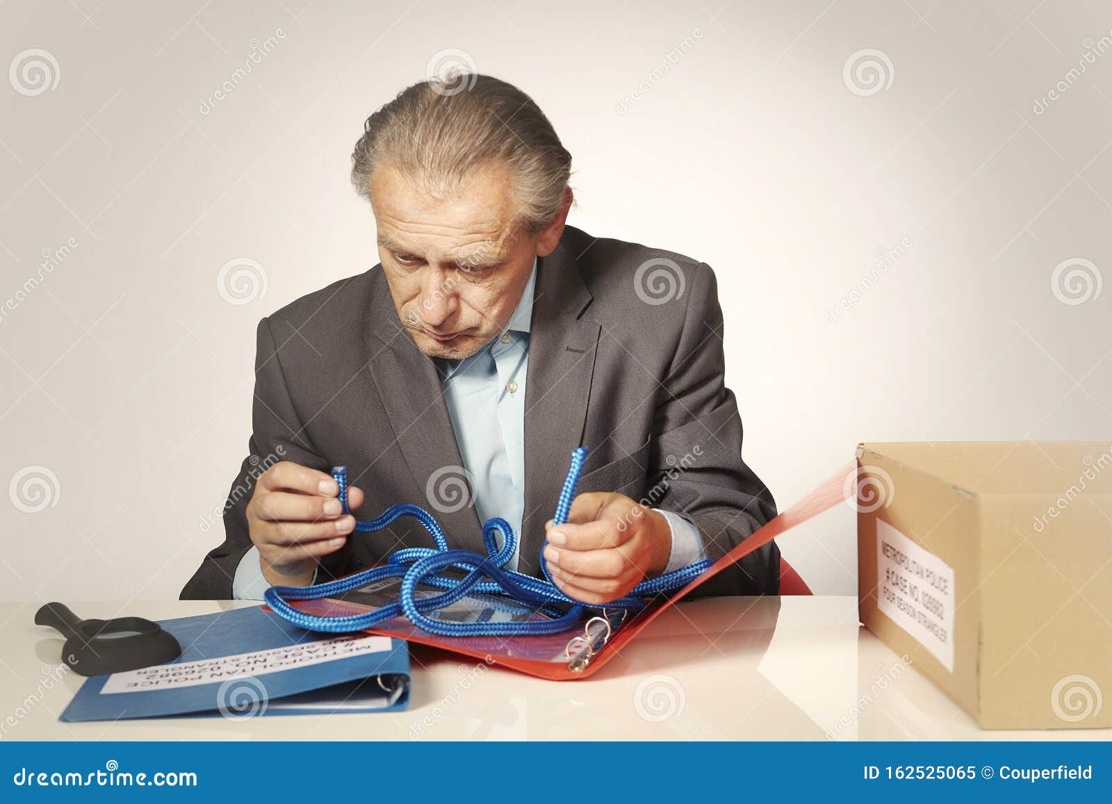 Detective Agent Studying Case and Documentation and Evidences Stock ...