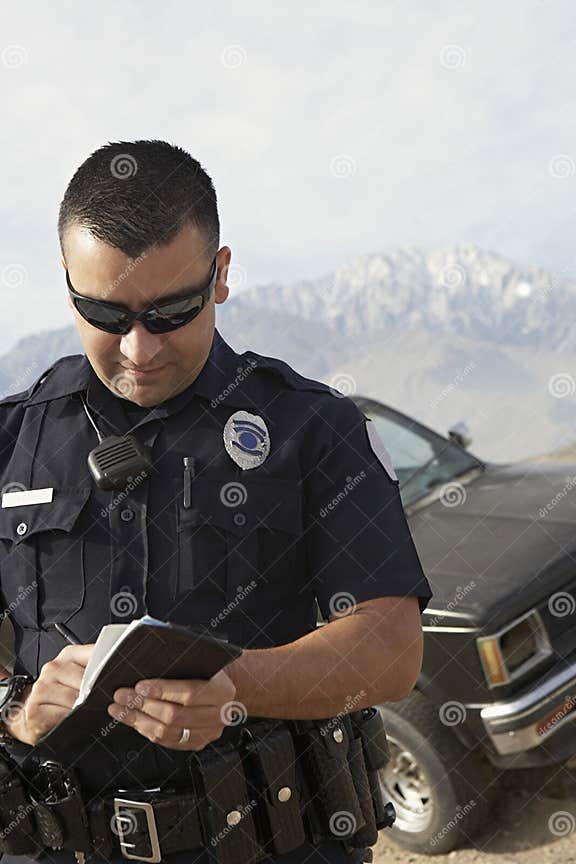 Police Officer Taking Notes Stock Image - Image of adult, security ...