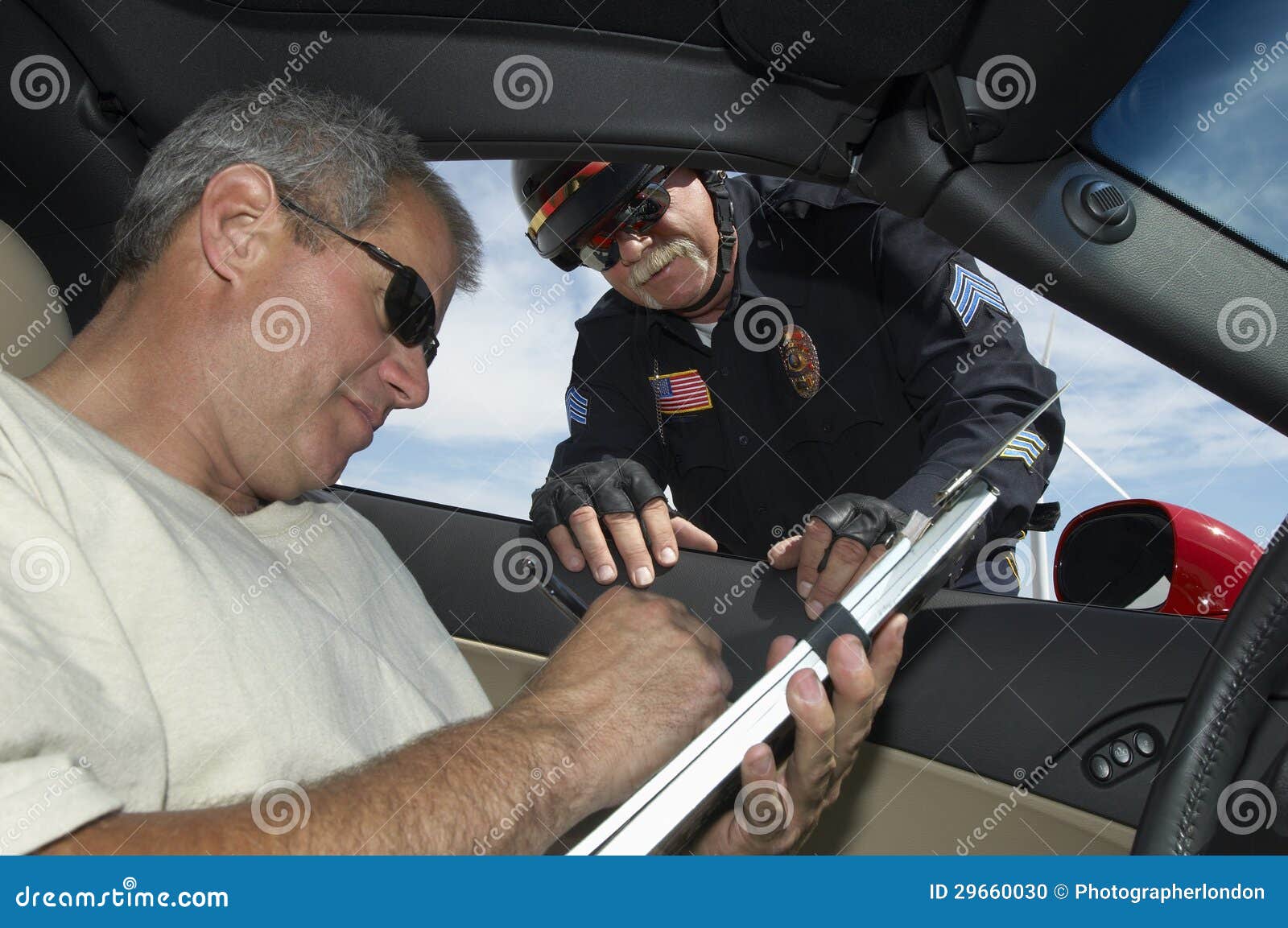 Police Officer Watching Driver Sign Papers Stock Photo - Image of ...