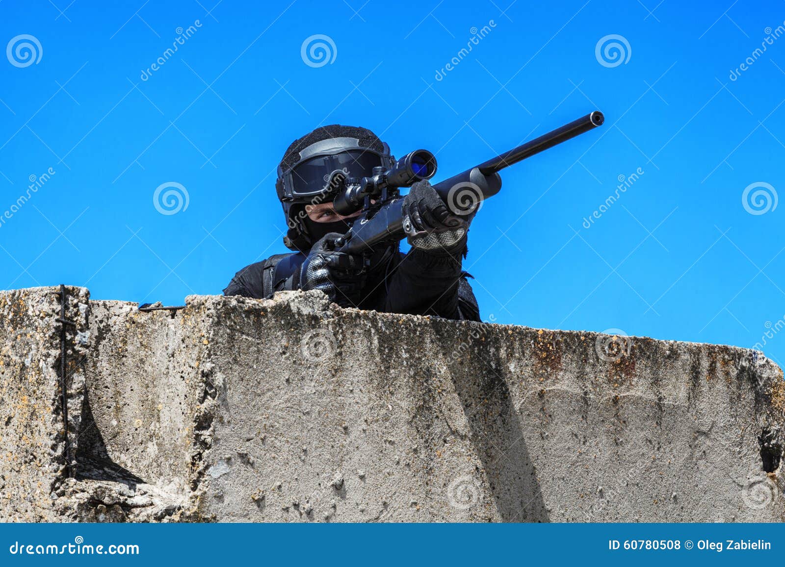 Police Sniper Aiming At The Scope Of His Rifle Stock Photo ...