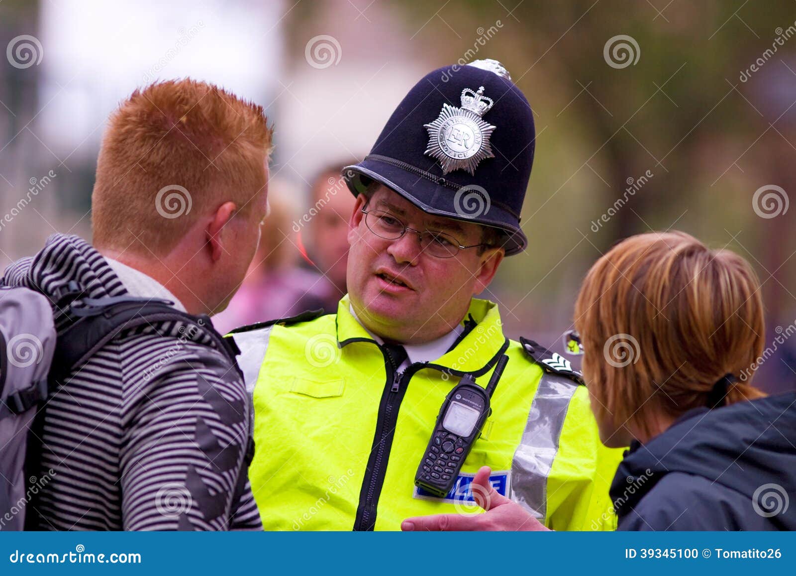 Man In English Policeman Uniform Standing Next To Classic Car Painted ...