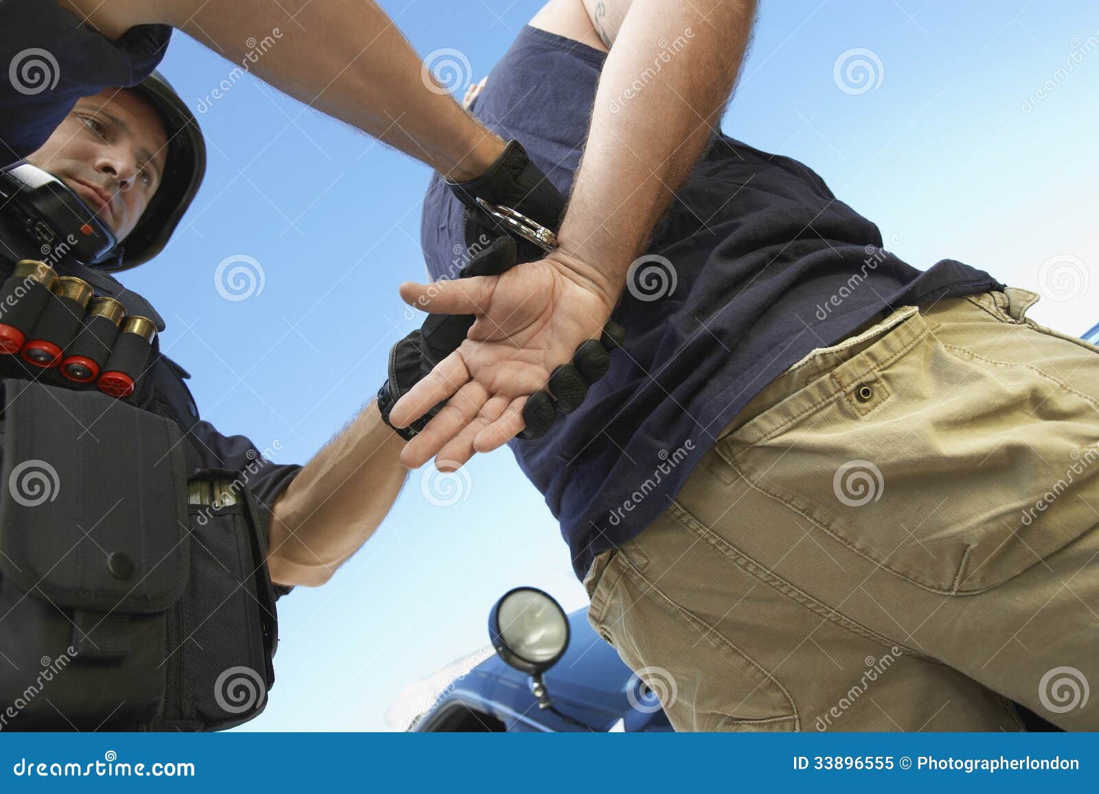 Policeman Arresting Criminal Against Sky Stock Image - Image of ...