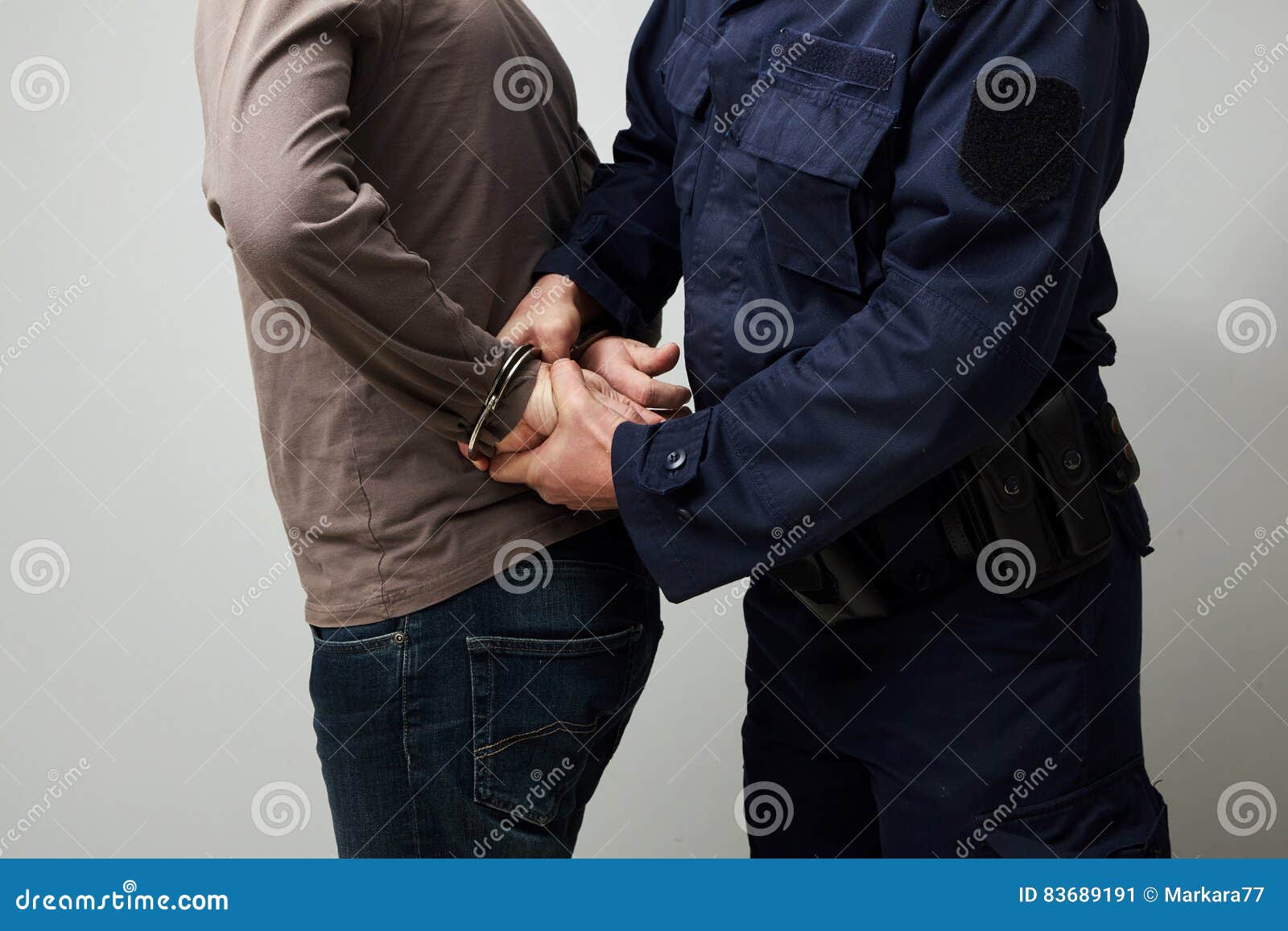 Policeman Handcuffing an Illigal Man. Stock Image - Image of male ...