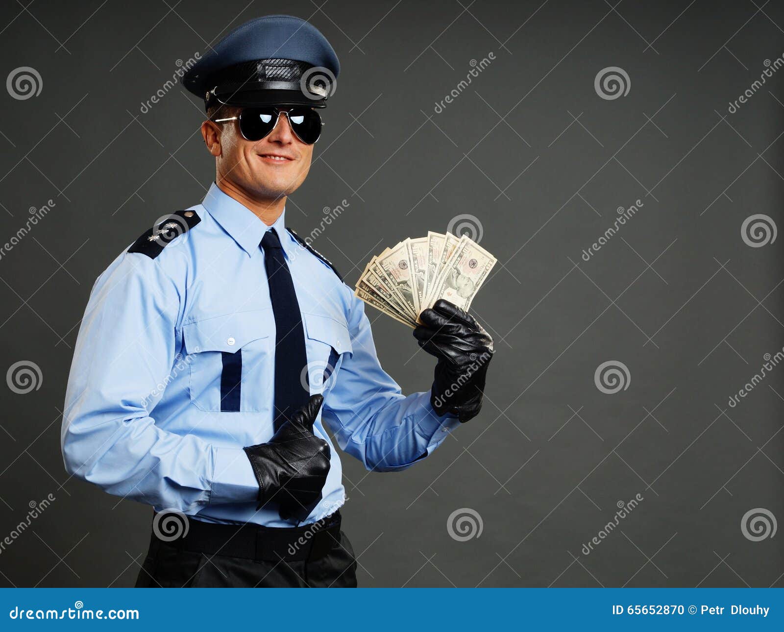 Policeman with money stock photo. Image of muscular, police - 65652870