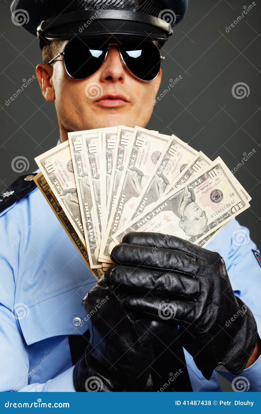 Policeman with with money stock photo. Image of handsome - 41487438