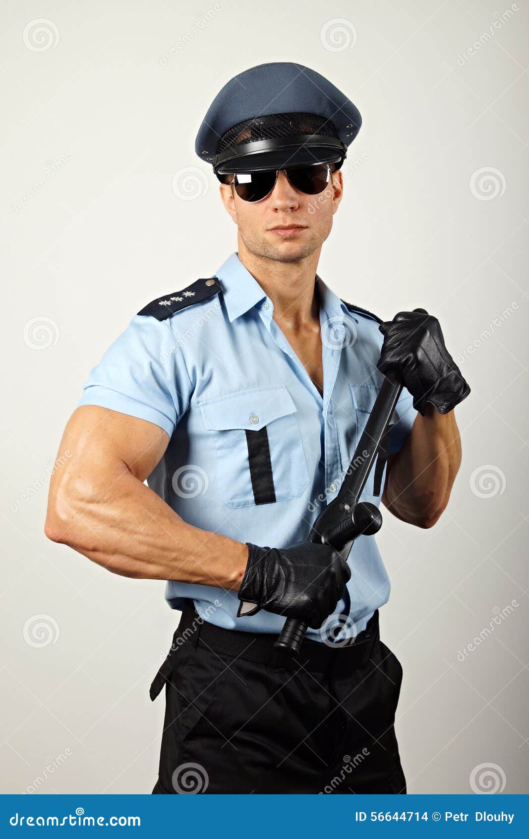 Policeman with nightstick stock photo. Image of shirt - 56644714
