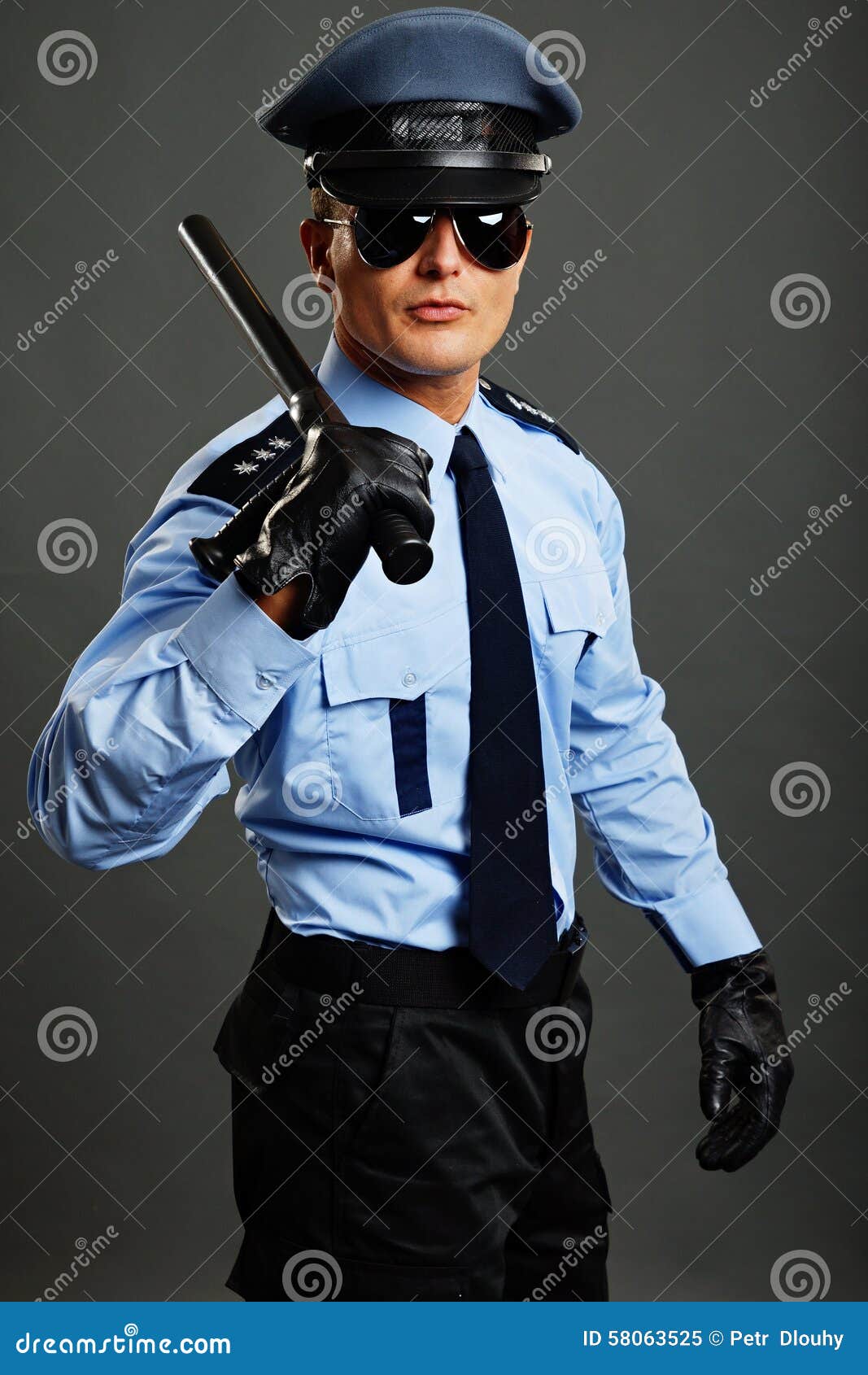 Policeman with nightstick stock image. Image of leather - 58063525