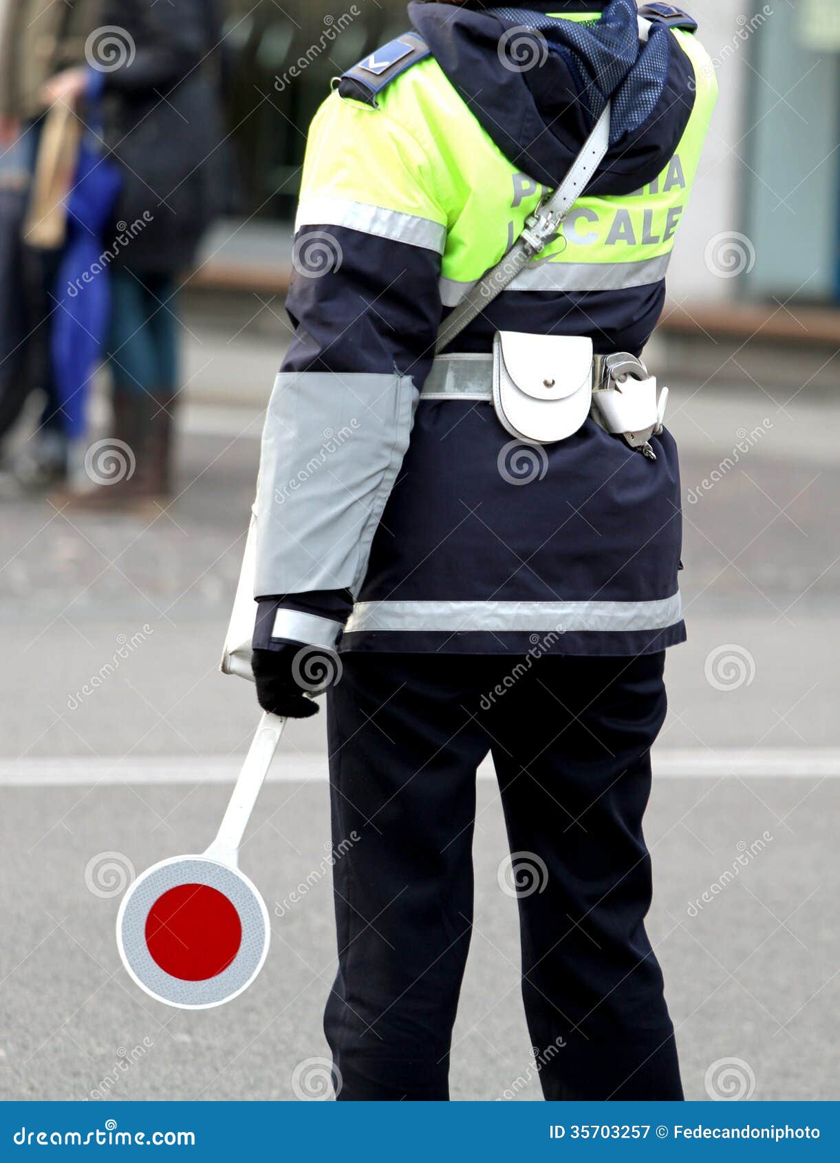 Policeman with the Paddle while Directing Traffic Stock Image - Image ...