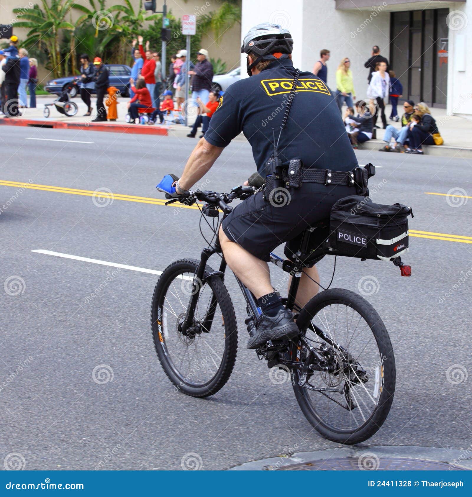 Policeman Riding a Bike editorial stock photo. Image of protection ...
