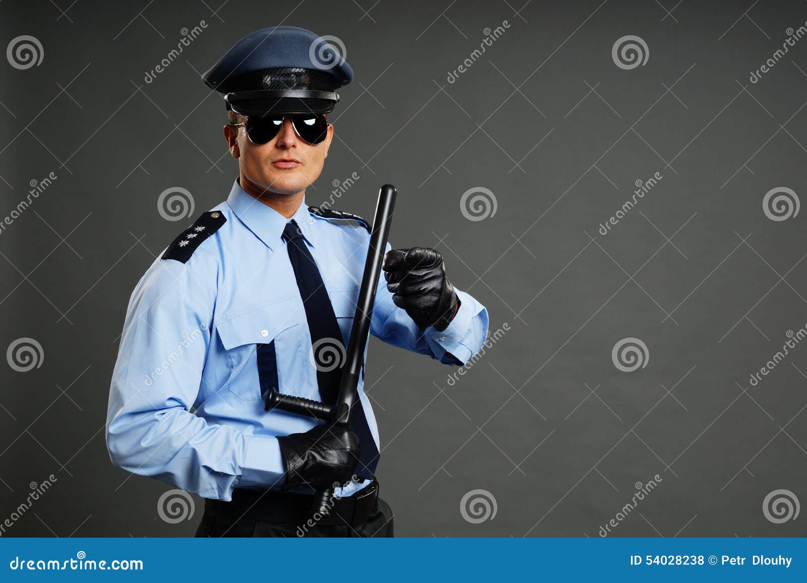 Policeman Shows with Nightstick Stock Photo - Image of write, cheerful ...