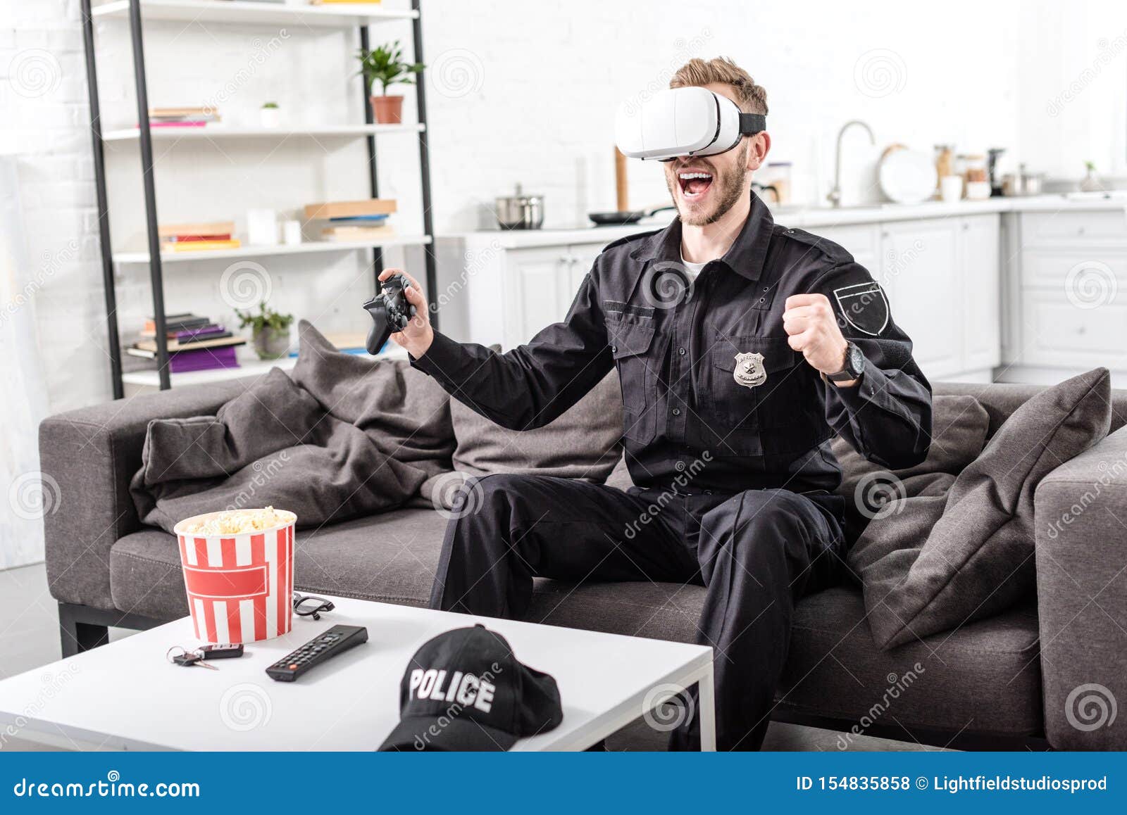 Policeman with Virtual Reality Headset on Head Playing Video Game and ...