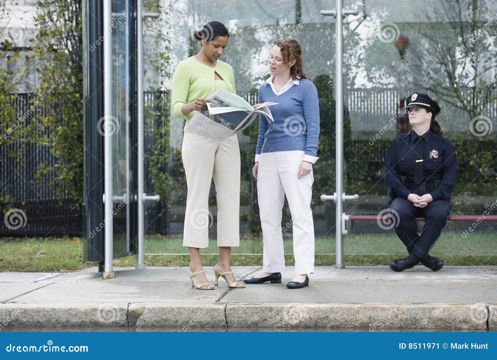 Policewoman Observing at an Urban Bus Stop. Stock Image - Image of ...