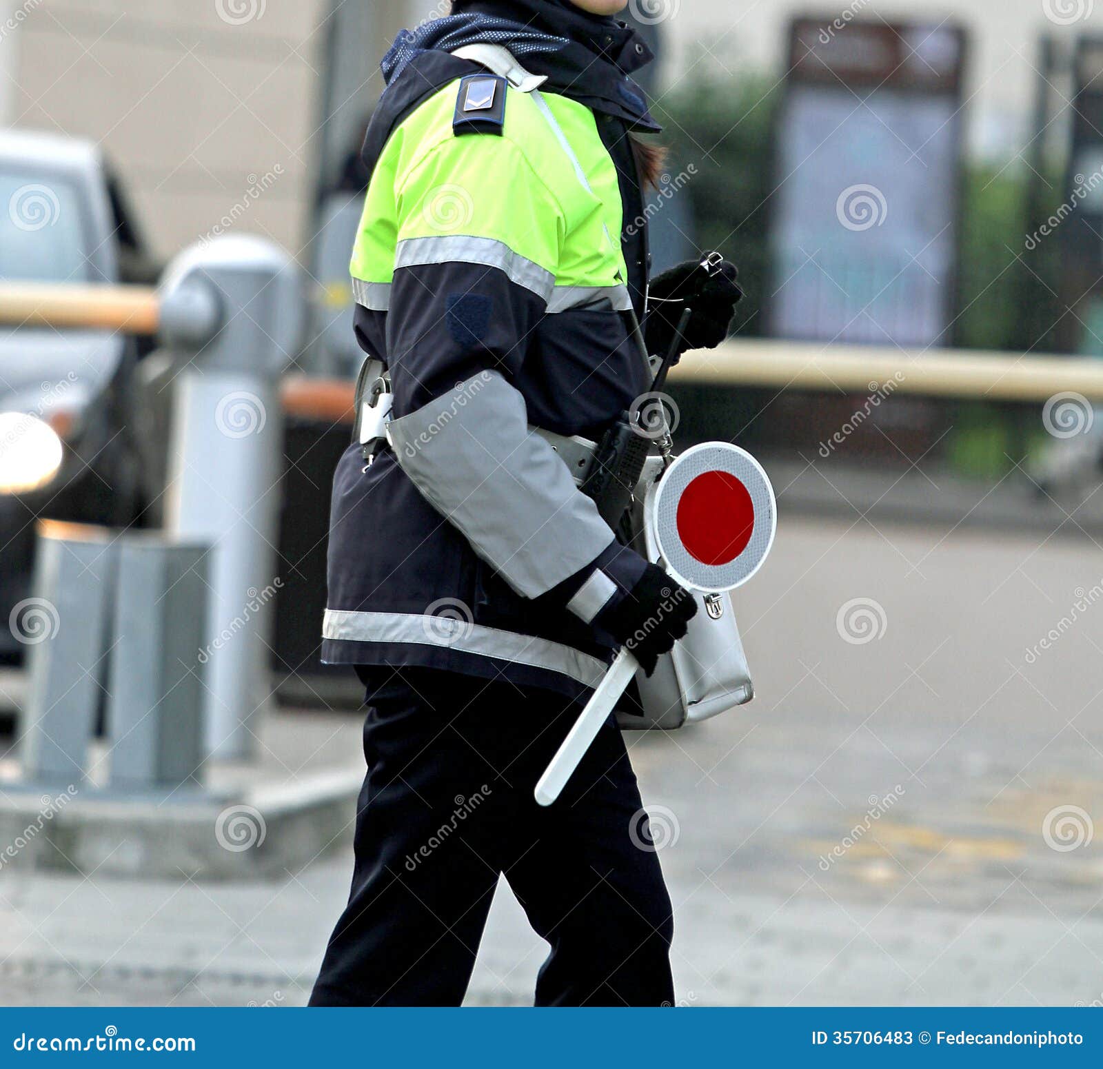 Policewoman with the Paddle while Directing Traffic Stock Image - Image ...
