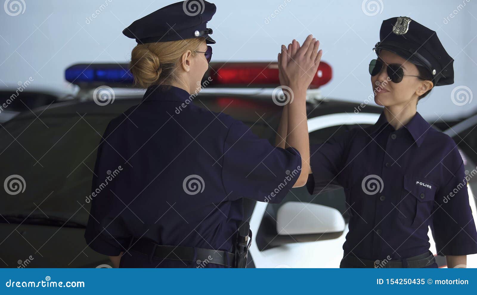 Policewomen Giving High Five and Smiling, Well Done Duty, Professional ... Policewomen Giving High Five and Smiling, Well Done Duty, Professional ...