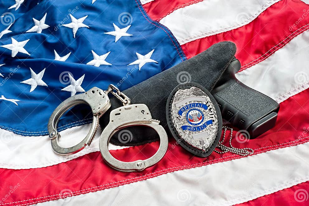 Polisemblem Och Tryckspruta Fotografering för Bildbyråer - Bild av ...