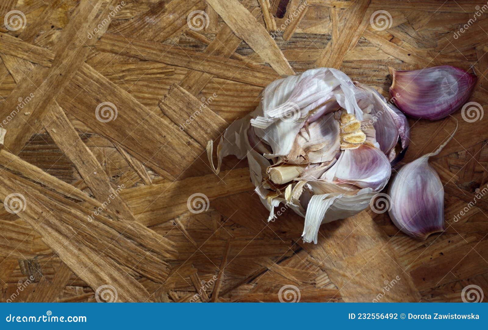 Polish garlic on plywood stock photo. Image of produce - 232556492