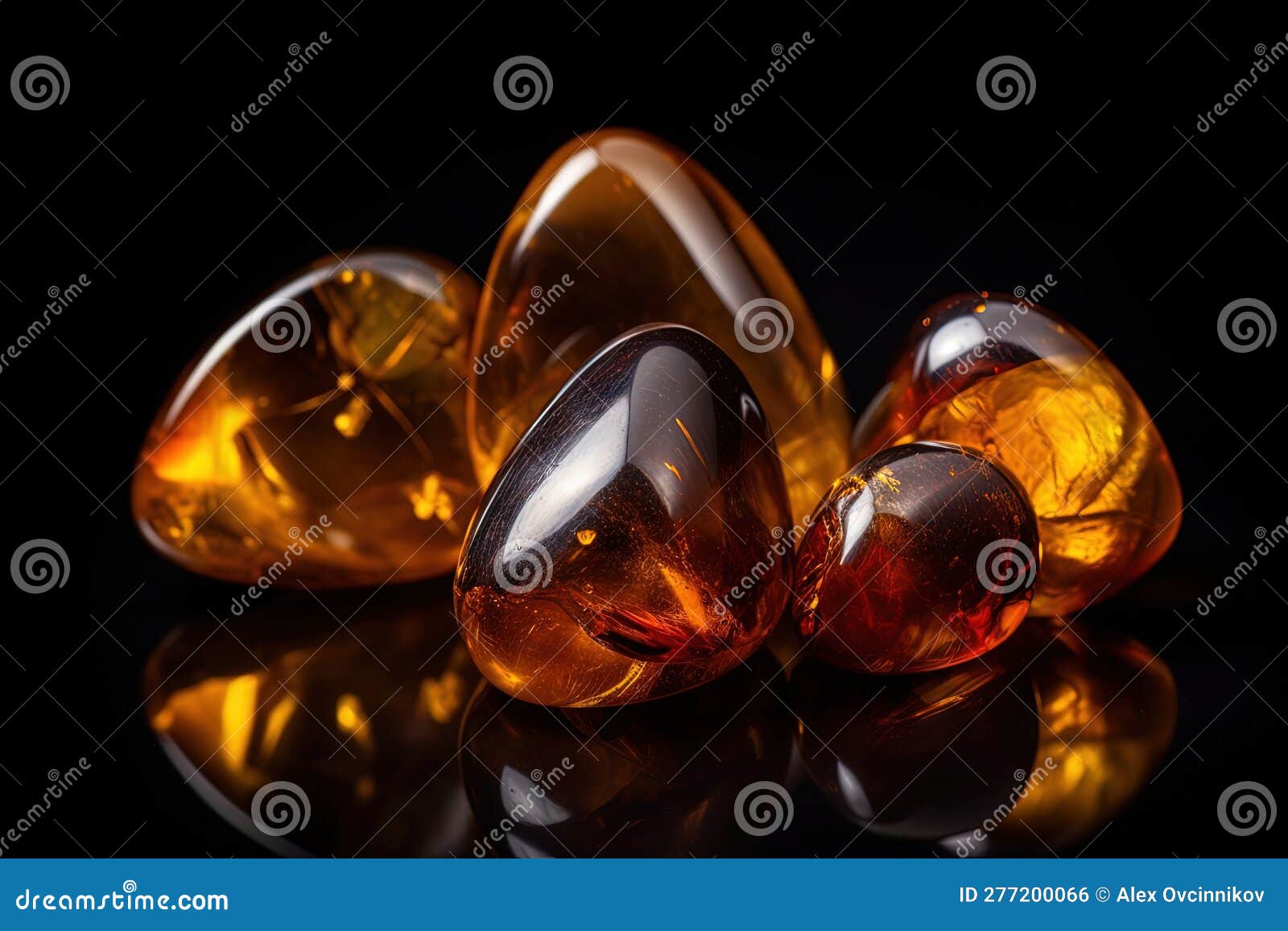 Polished Amber Stones on Black Background: a Touch of Ancient Elegance ...