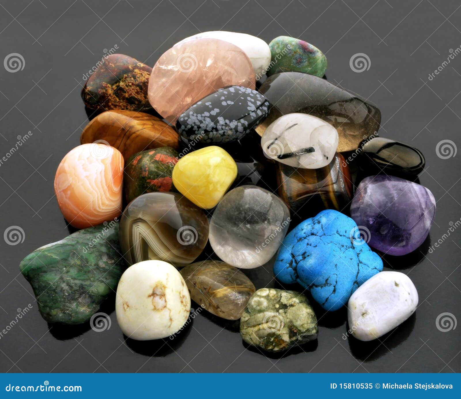 Heap Of Tumbled Stones In Rainbow Colors Representing Chakras Stock ...