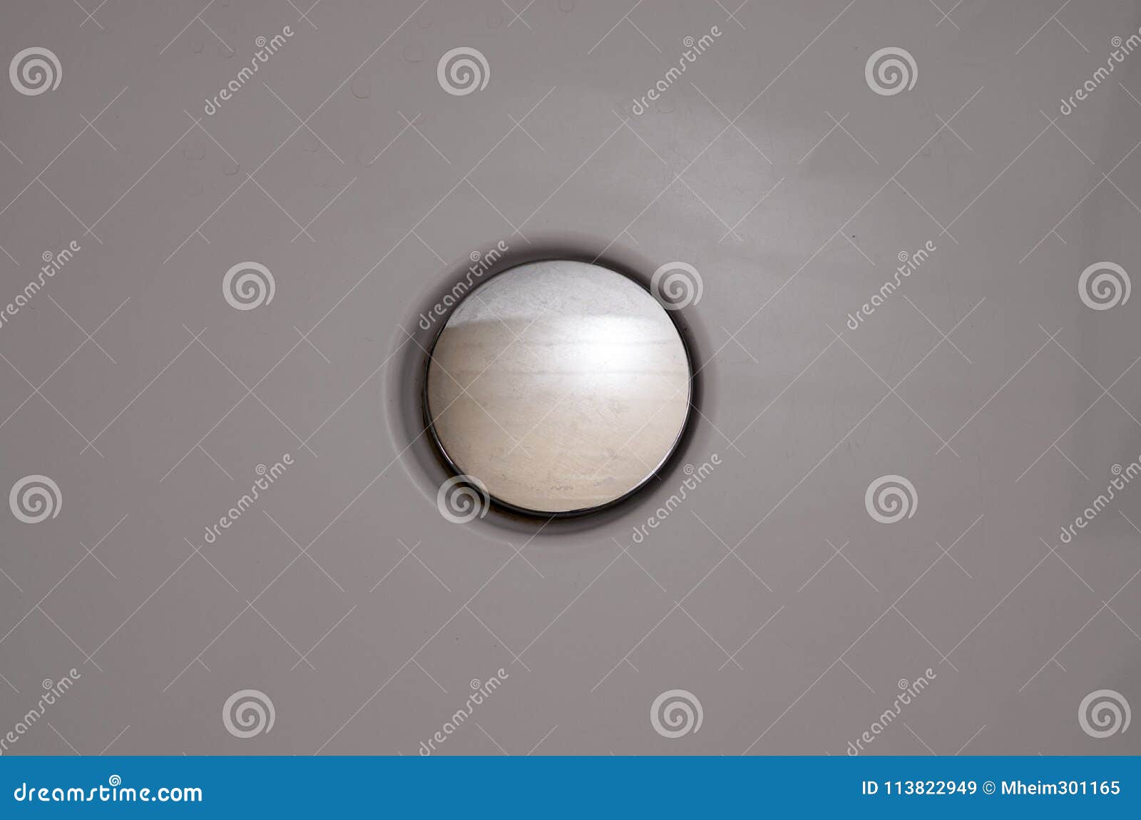 Polished Metal Button Inset in a Grey Surround Stock Image - Image of ...