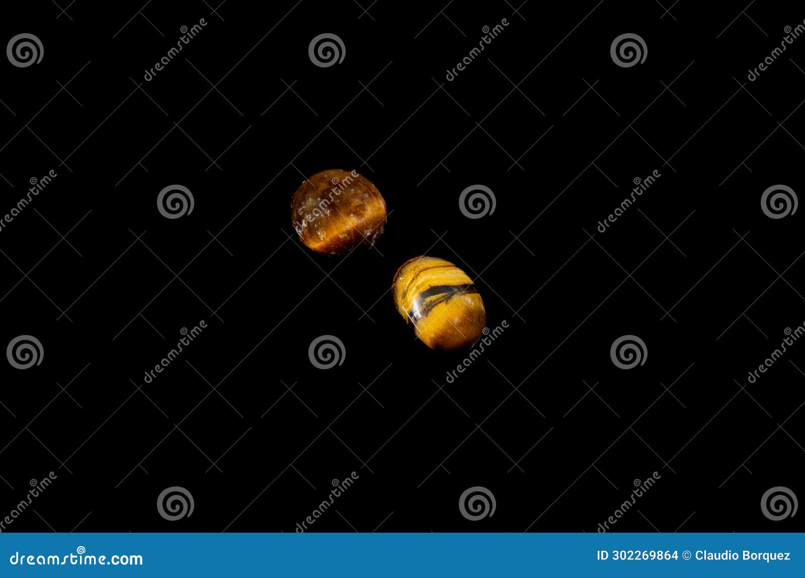 Polished Tiger S Eye on Black Background Stock Photo - Image of ...