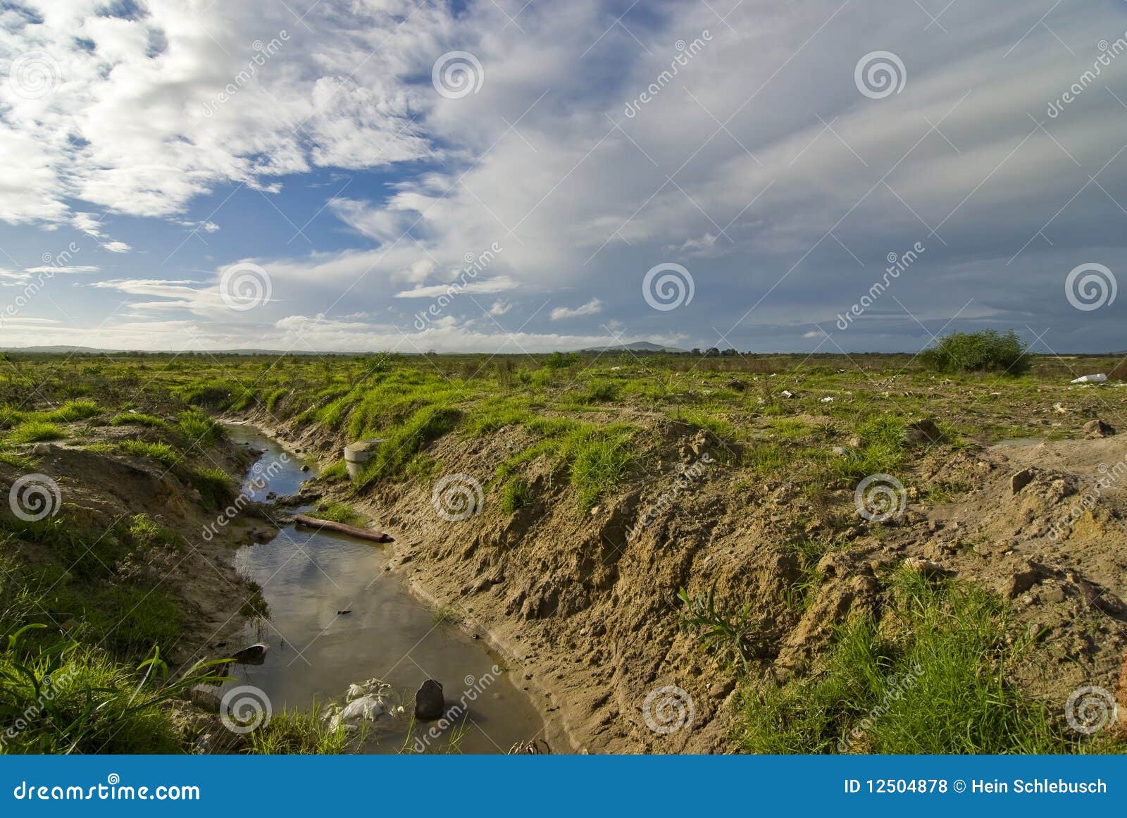 Polluted Stream with Landscape and Blue Skies Stock Photo - Image of ...