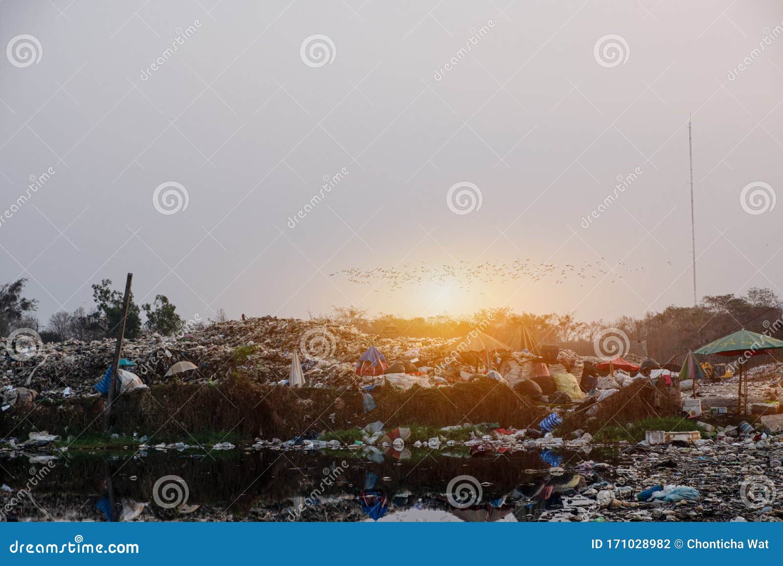 Polluted Water and Mountain Large Garbage Pile and Pollution at the Sun ...