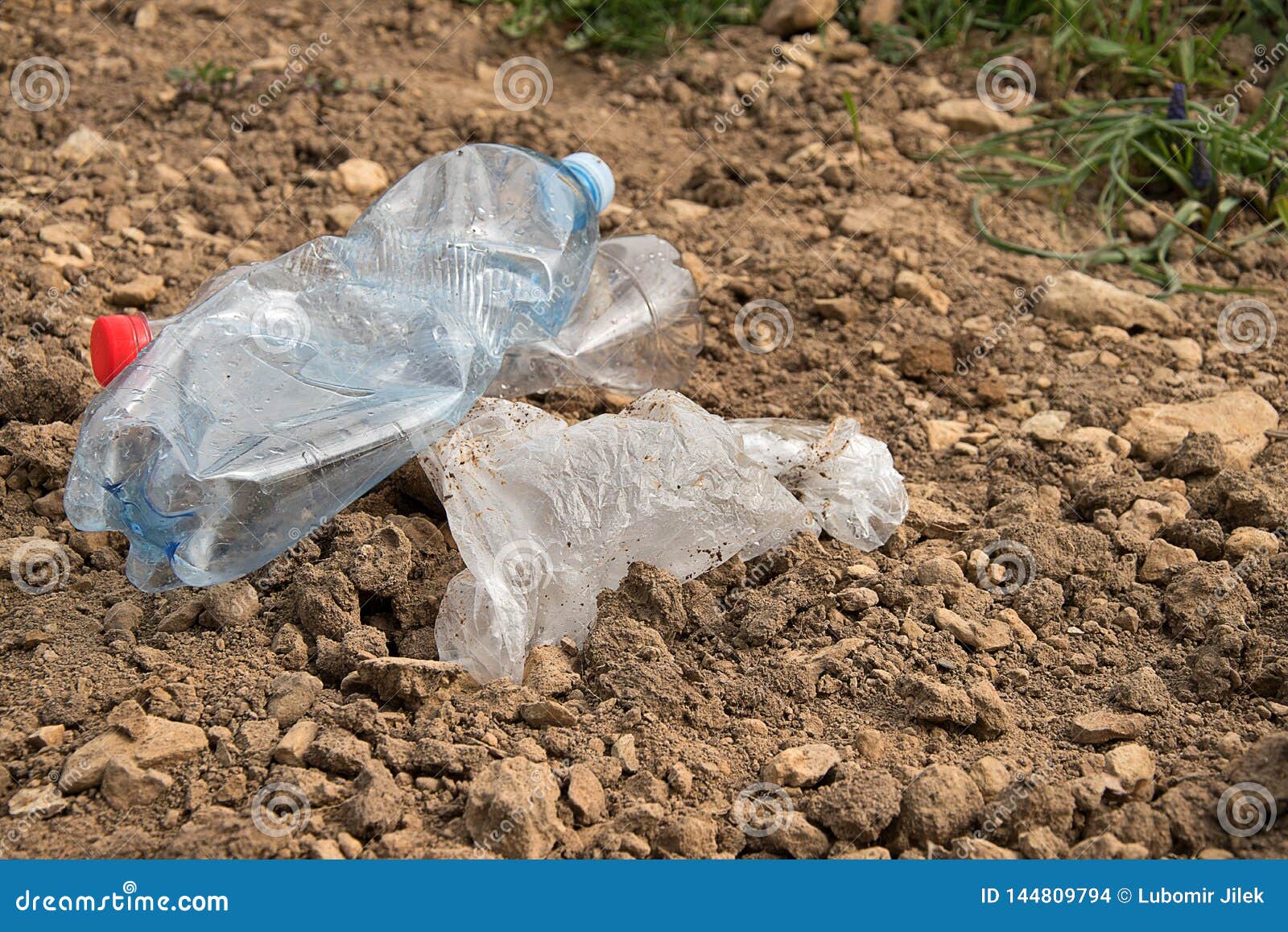 Pollution of Plastics on the Planet. Plastic Waste Buried in Clay ...