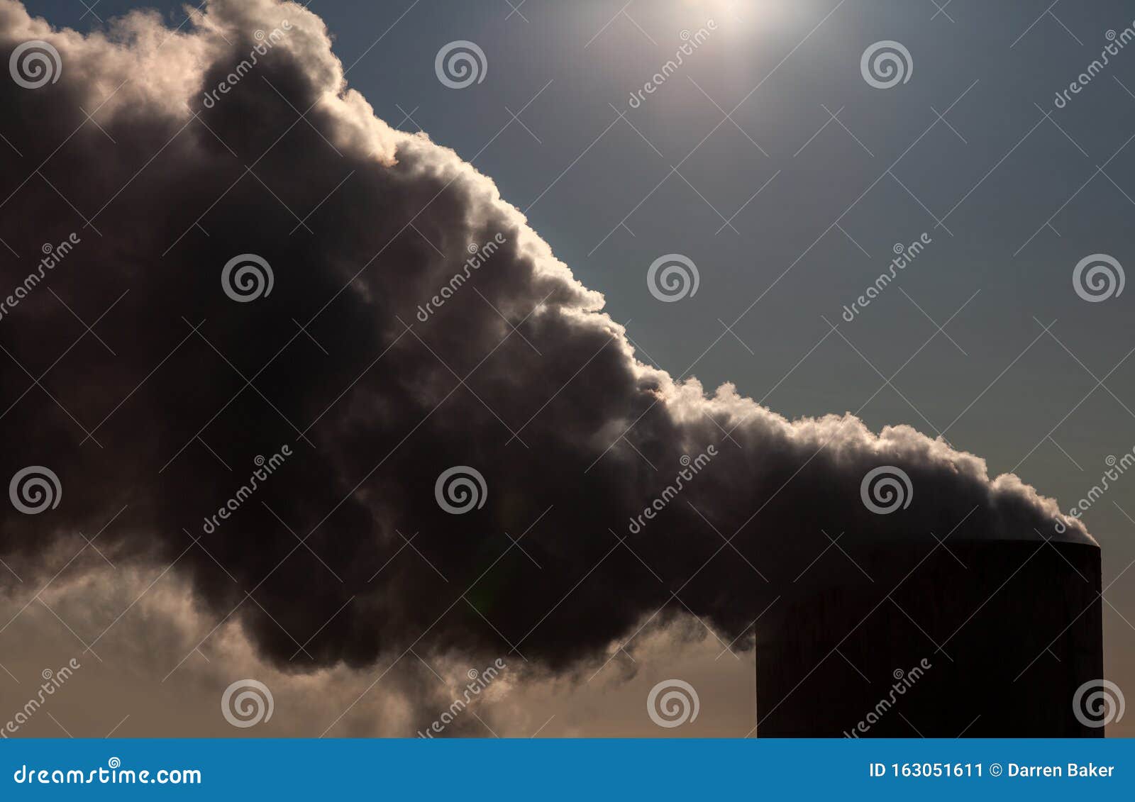 Pollution or Smoke Coming from a Chimney Blocking Out the Sun Stock ...