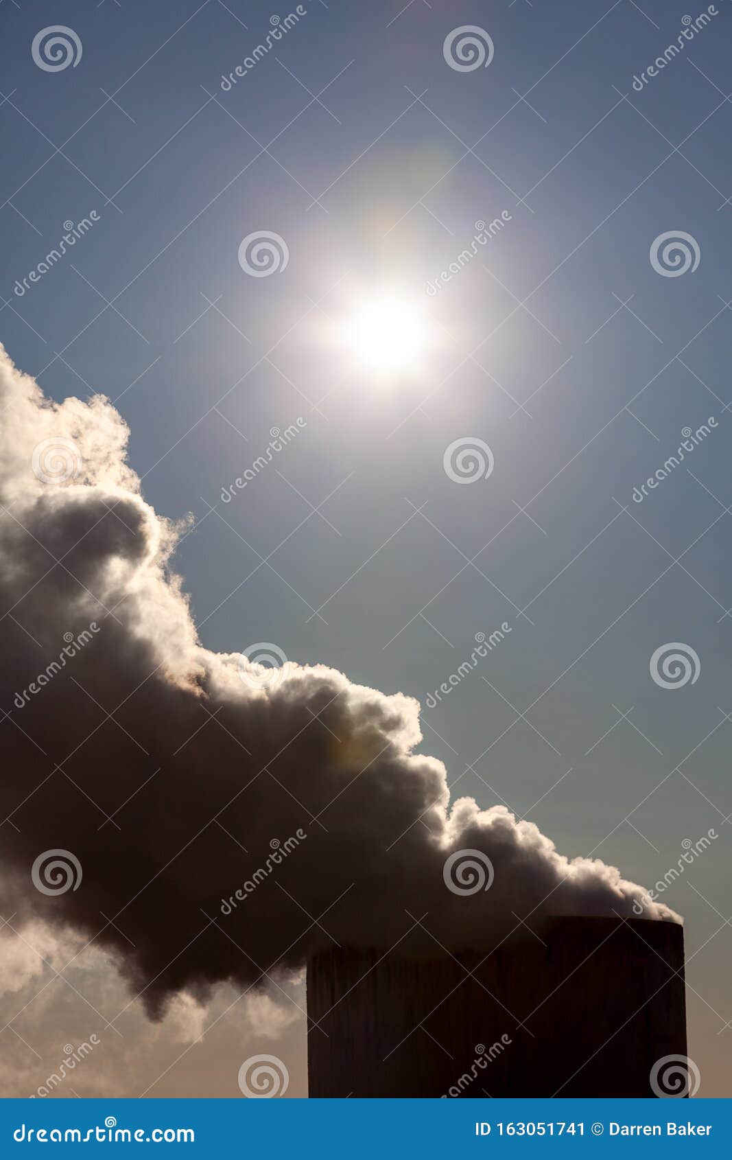 Pollution or Smoke Coming from a Chimney Blocking Out the Sun Stock ...