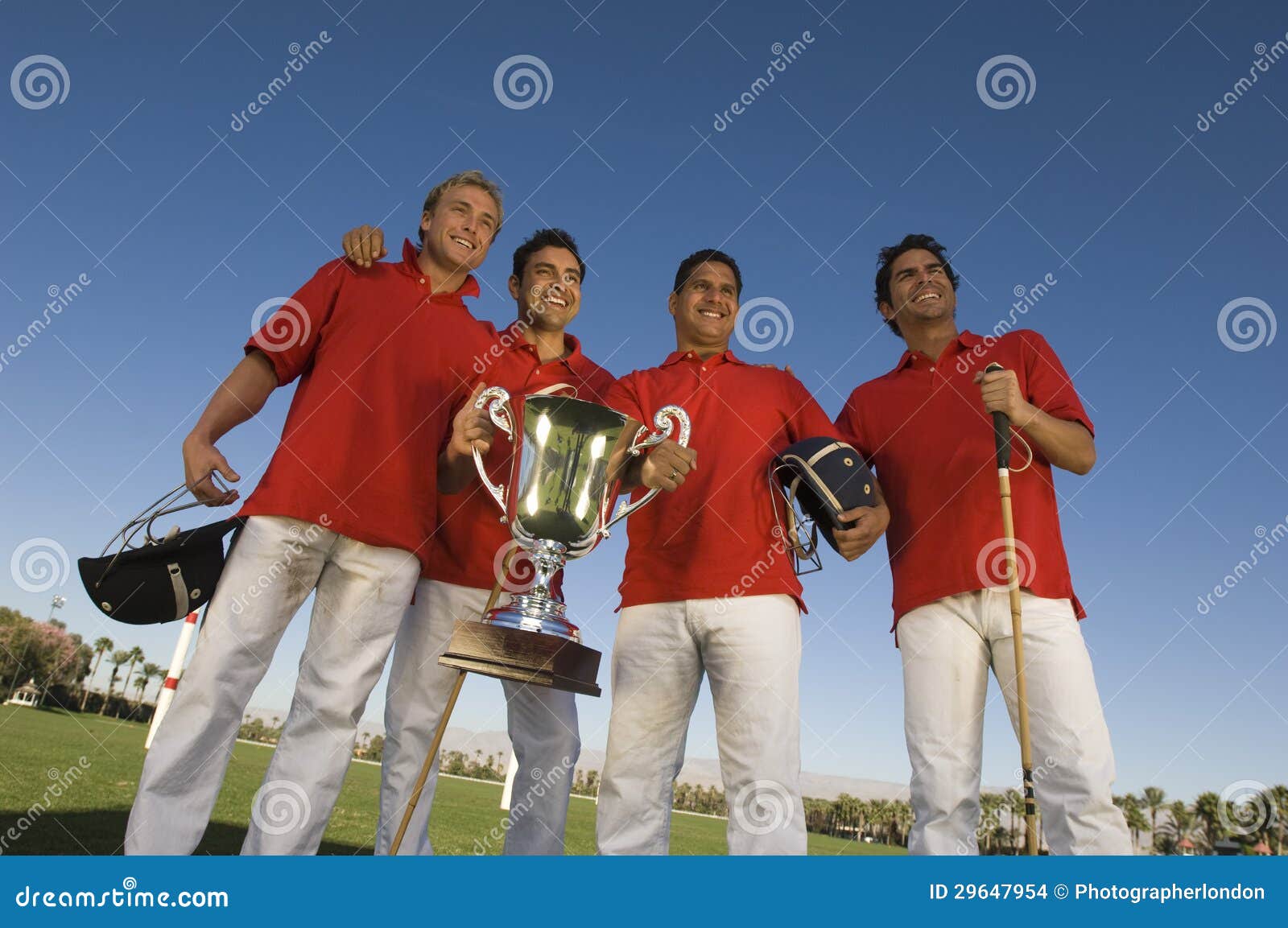 Polo Players with Trophy stock photo. Image of middle - 29647954