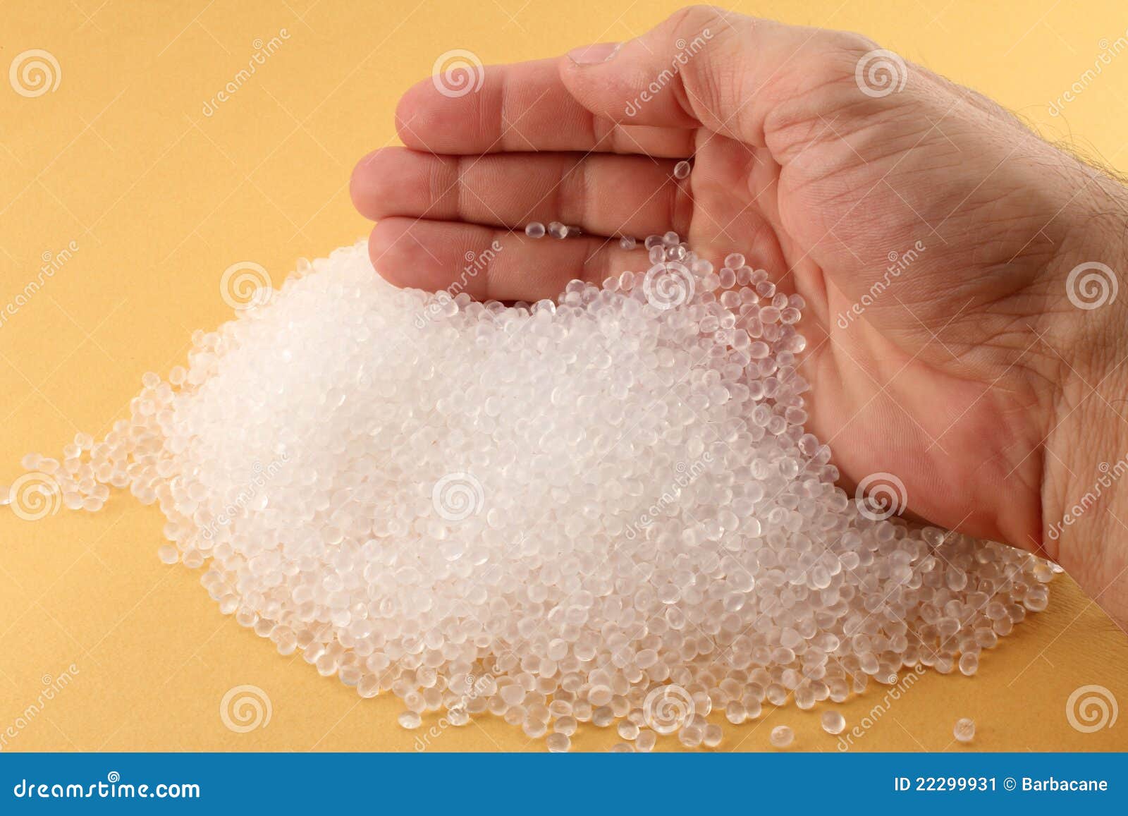 Polymers on hand stock image. Image of rice, polymers - 22299931