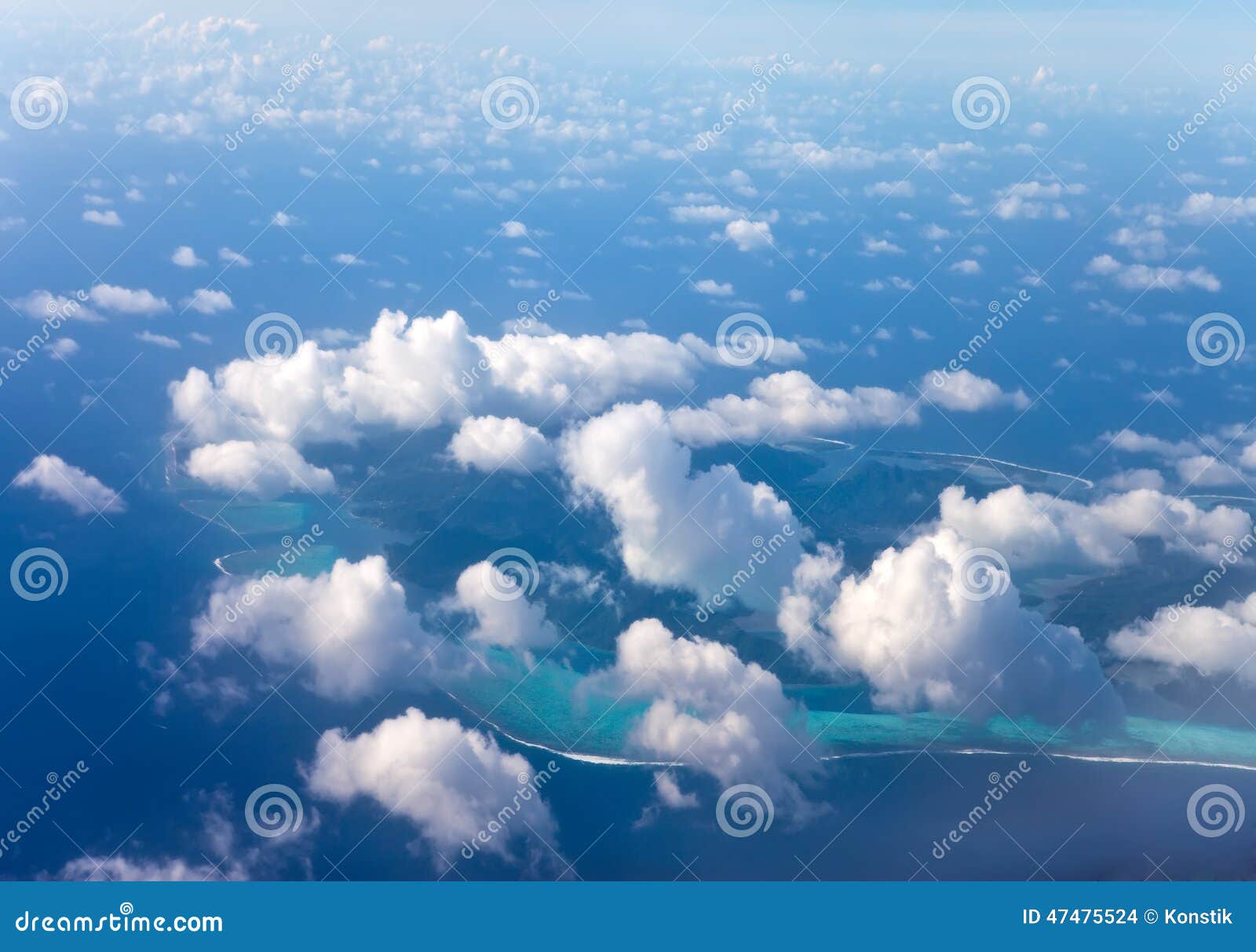 Polynesia. the Atoll in Ocean through Clouds. Aerial View. Stock Photo ...