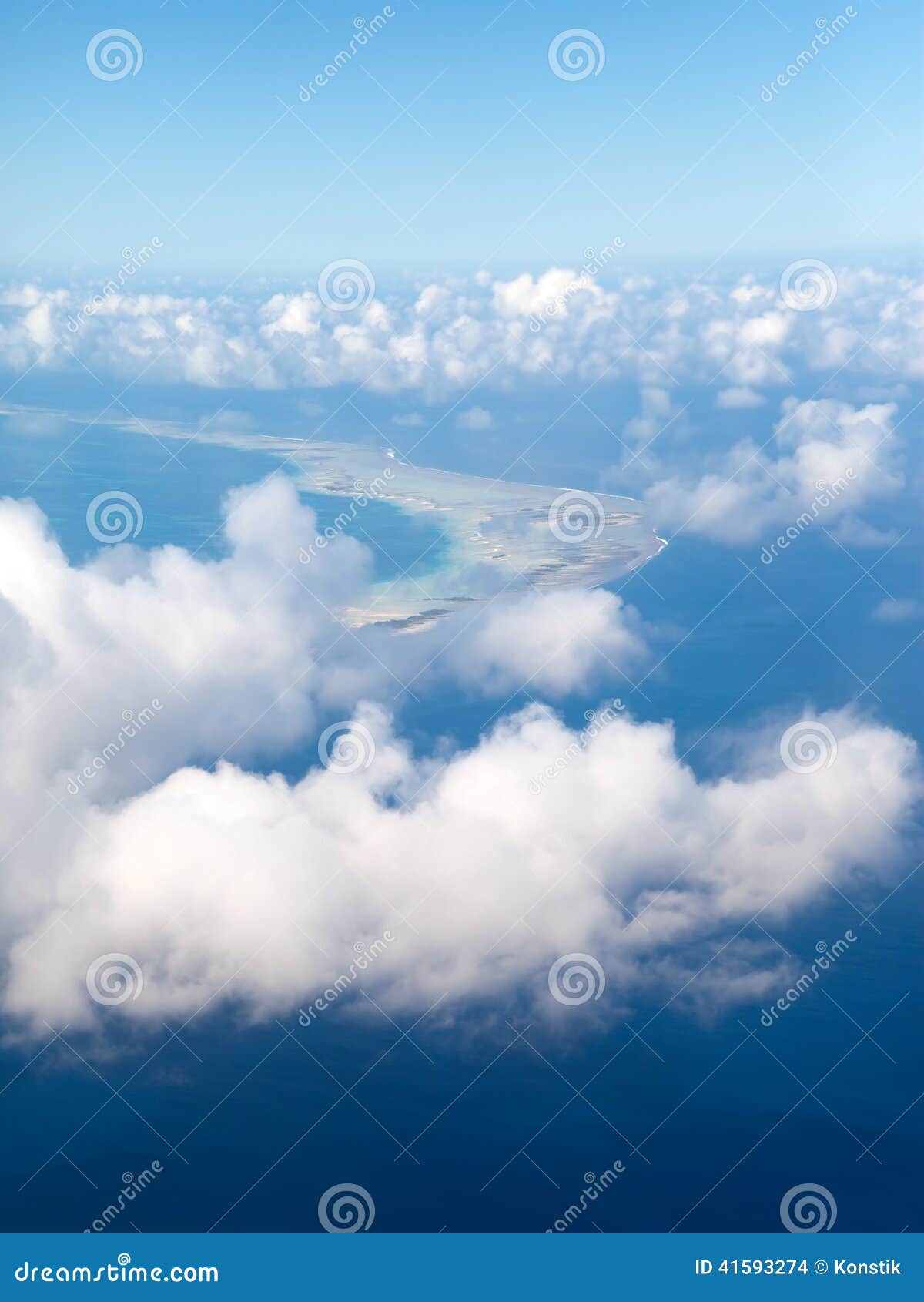 Polynesia. the Atoll Ring in Ocean is Visible through Clouds. Aerial ...