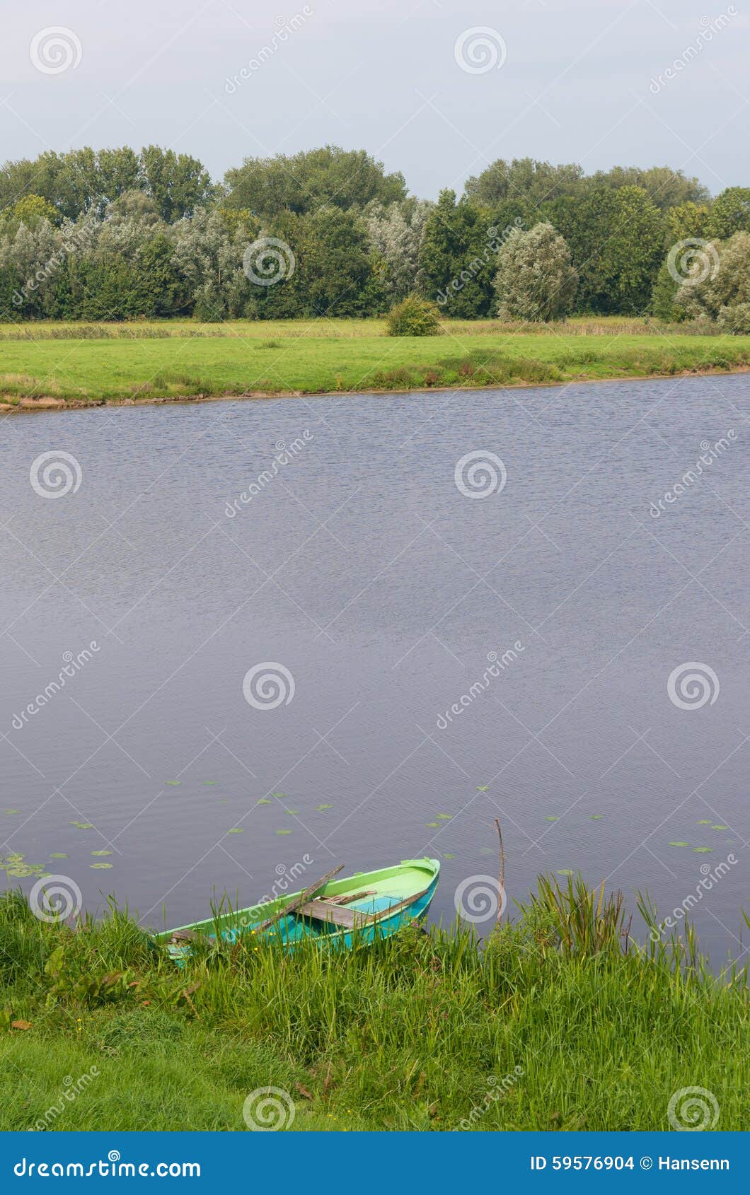 Pond with rowing boat stock photo. Image of betuwe, riverside - 59576904