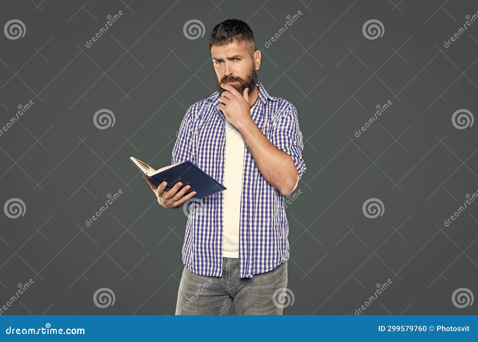 Pondering Bearded Man Reading Book on Grey Background Stock Photo ...