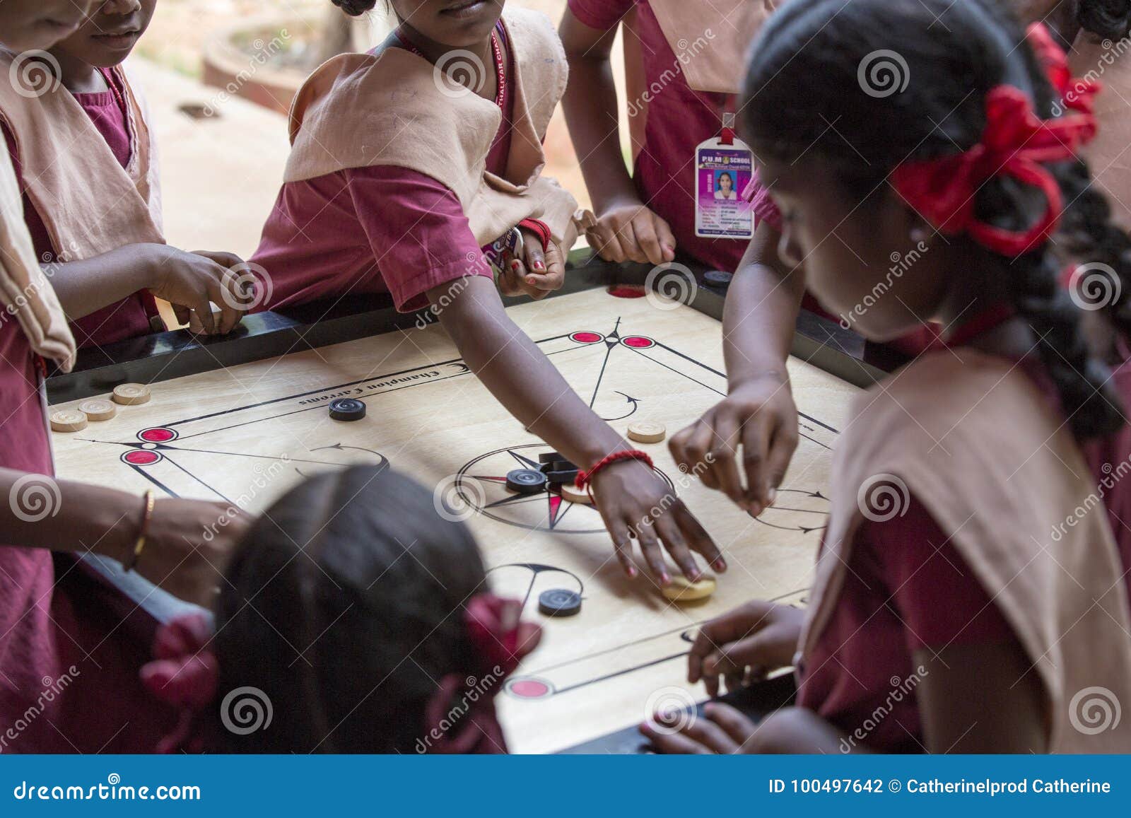Documentary Editorial Image. Children Playing Carrom At The Table. The ... Documentary Editorial Image. Children Playing Carrom At The Table. The ...