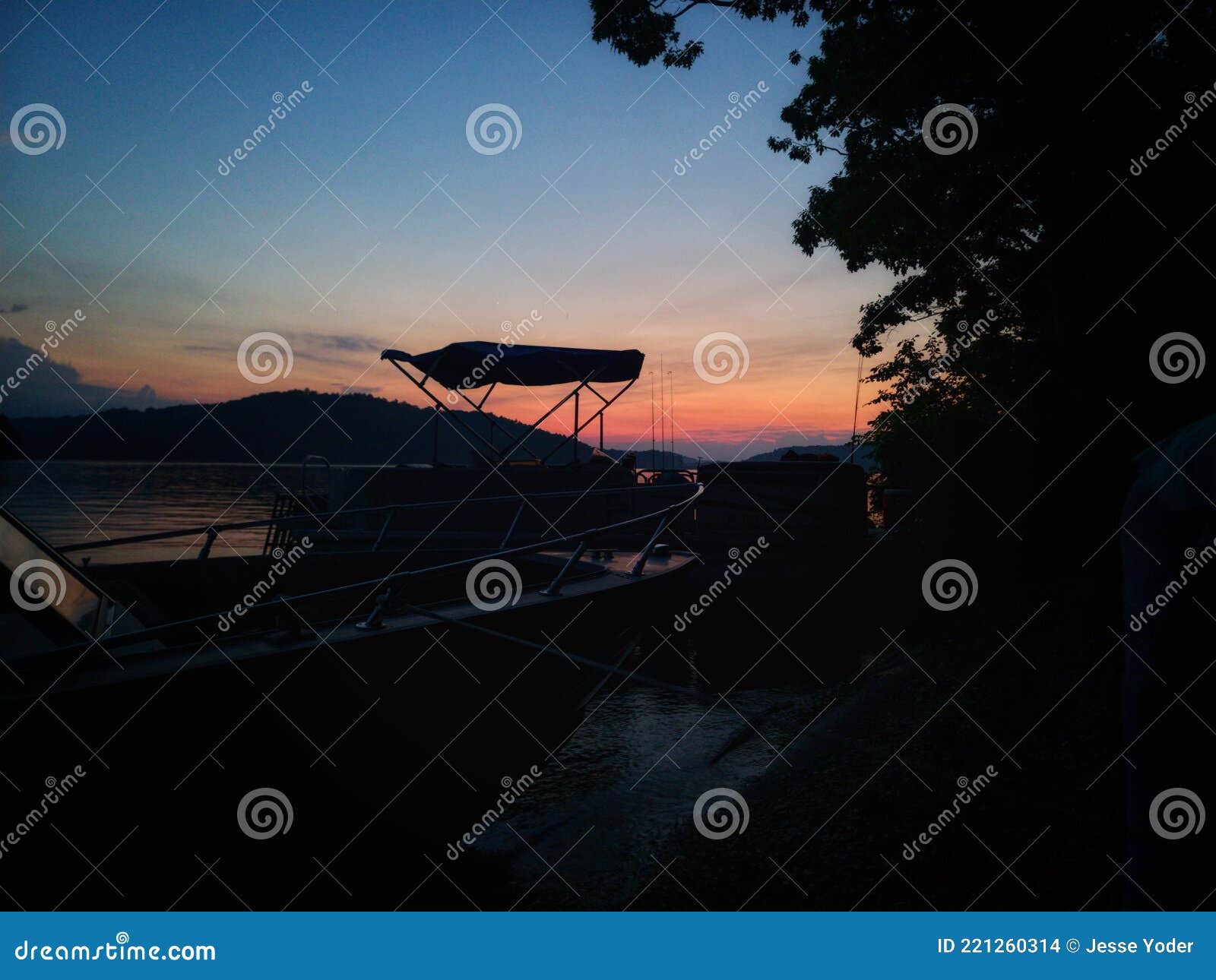 Pontoon and Boat on Sunset Lake Stock Photo - Image of sunset, pontoon ...