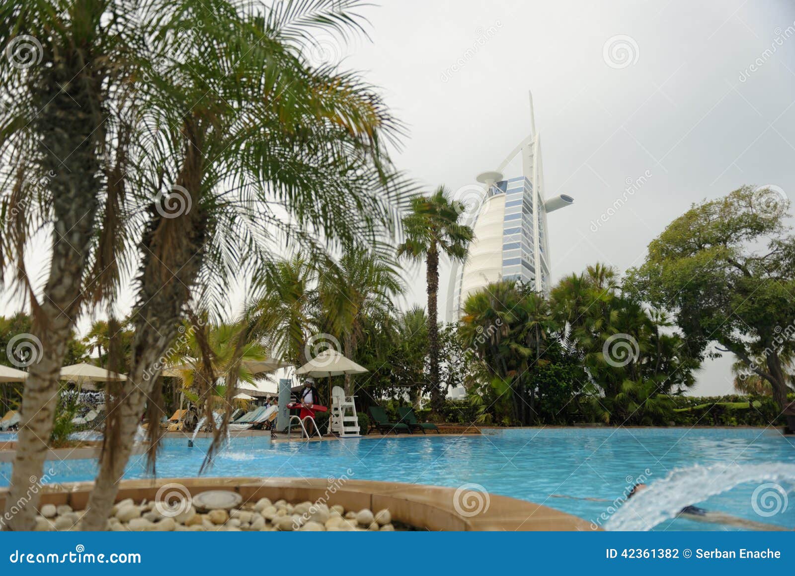 Pool with Burj Al Arab in Background Editorial Photography - Image of ...