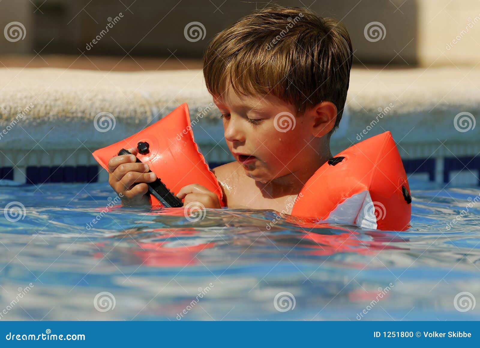 Boy in Pool with Cell Phone Stock Photo - Image of suit, mobile: 1251800
