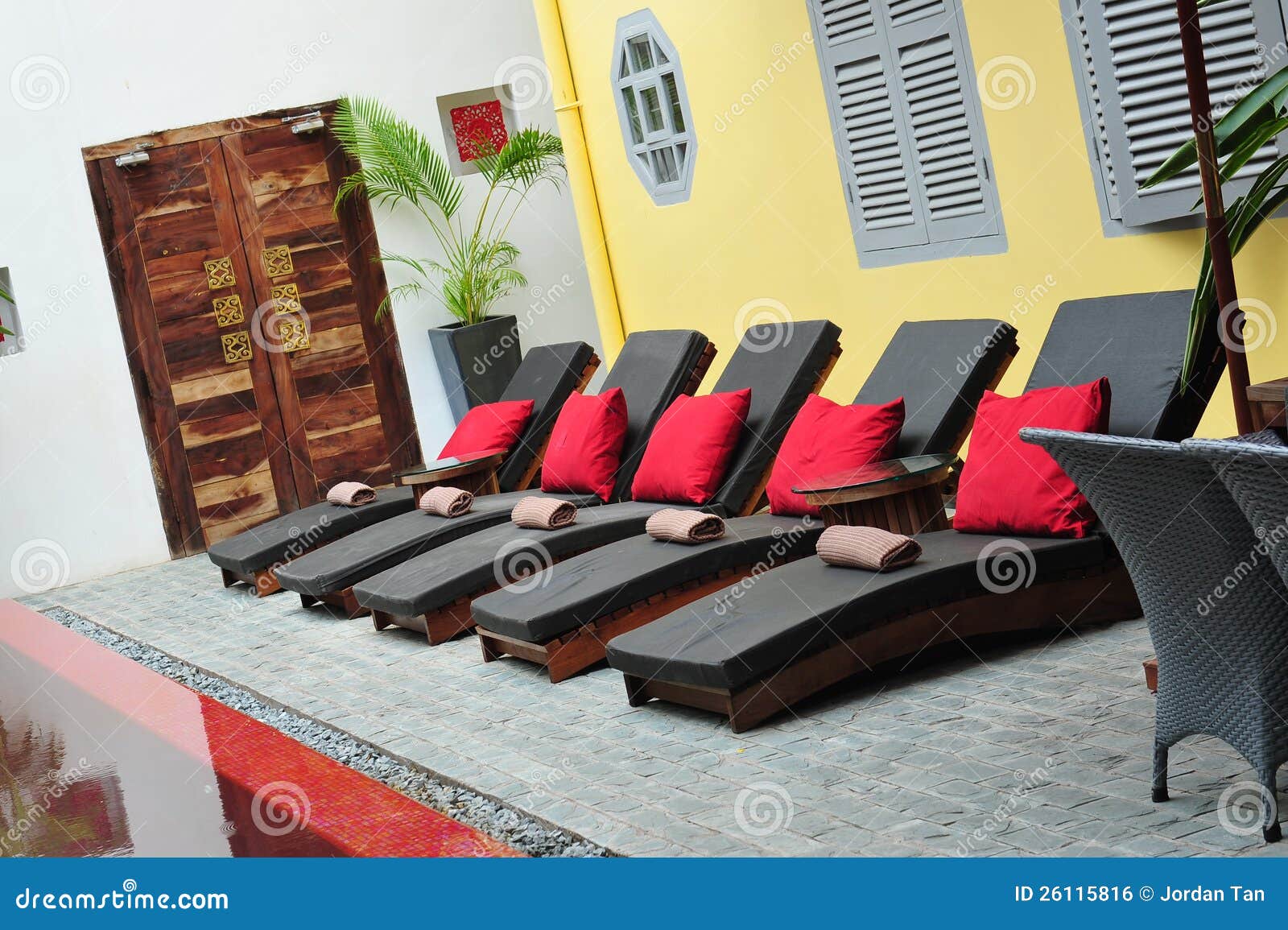 Pool chairs in a resort stock photo. Image of relax, pillow - 26115816