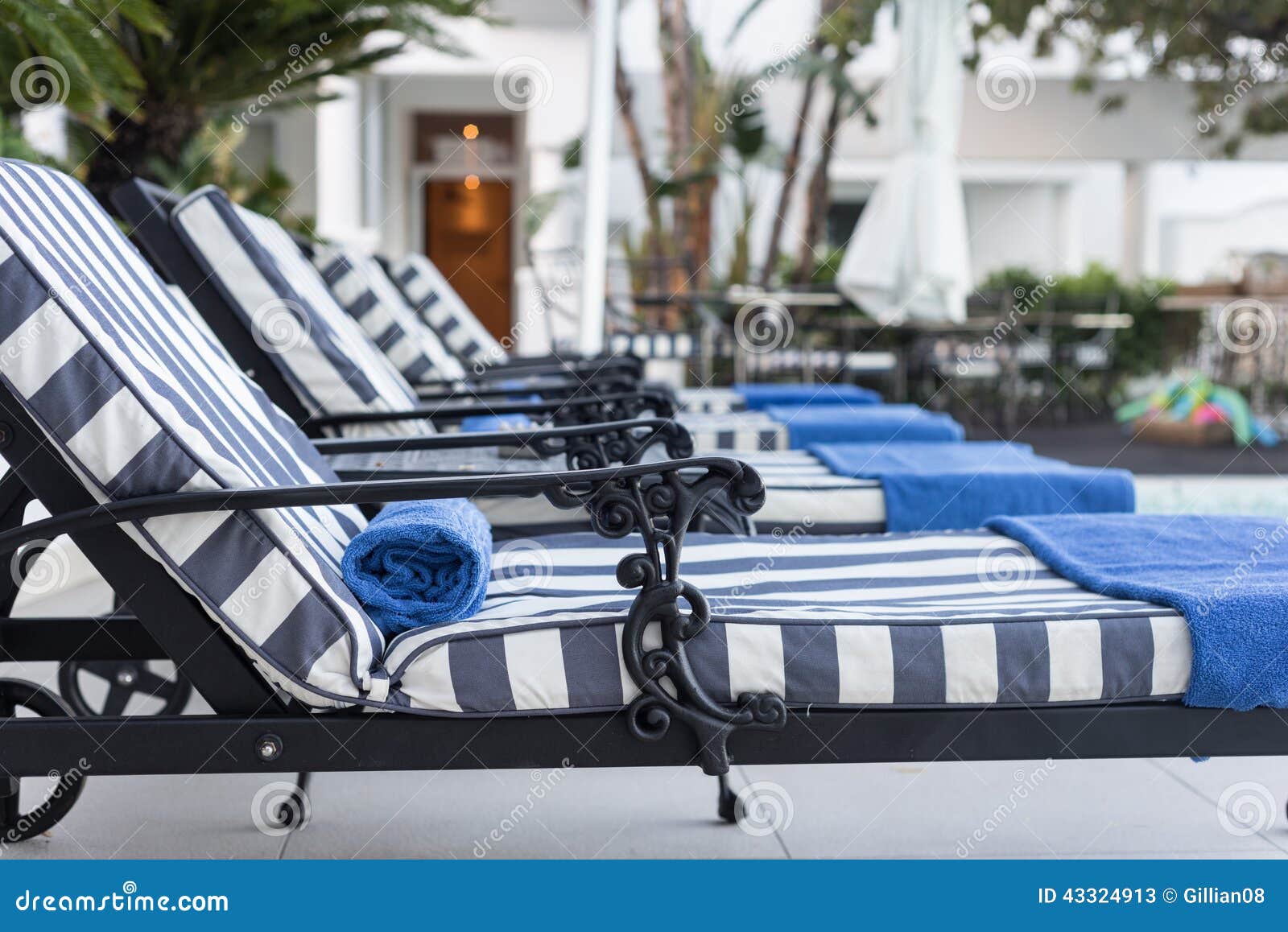 Pool chairs stock image. Image of resort, white, striped - 43324913
