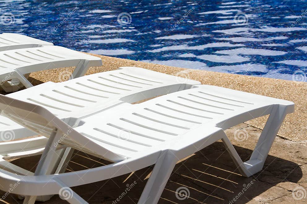 Pool chairs stock photo. Image of relaxation, blue, cancun - 290345196
