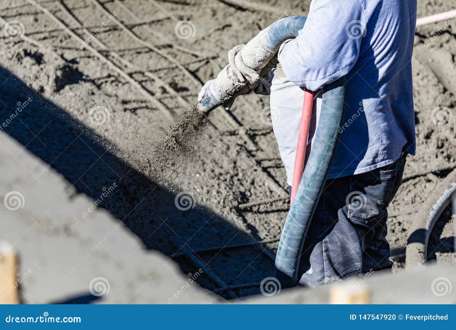 Pool Construction Worker Shooting Concrete, Shotcrete or Gunite through ...